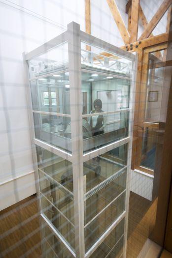 Customised Glass Platform Lift for NHS Practice | Stannah